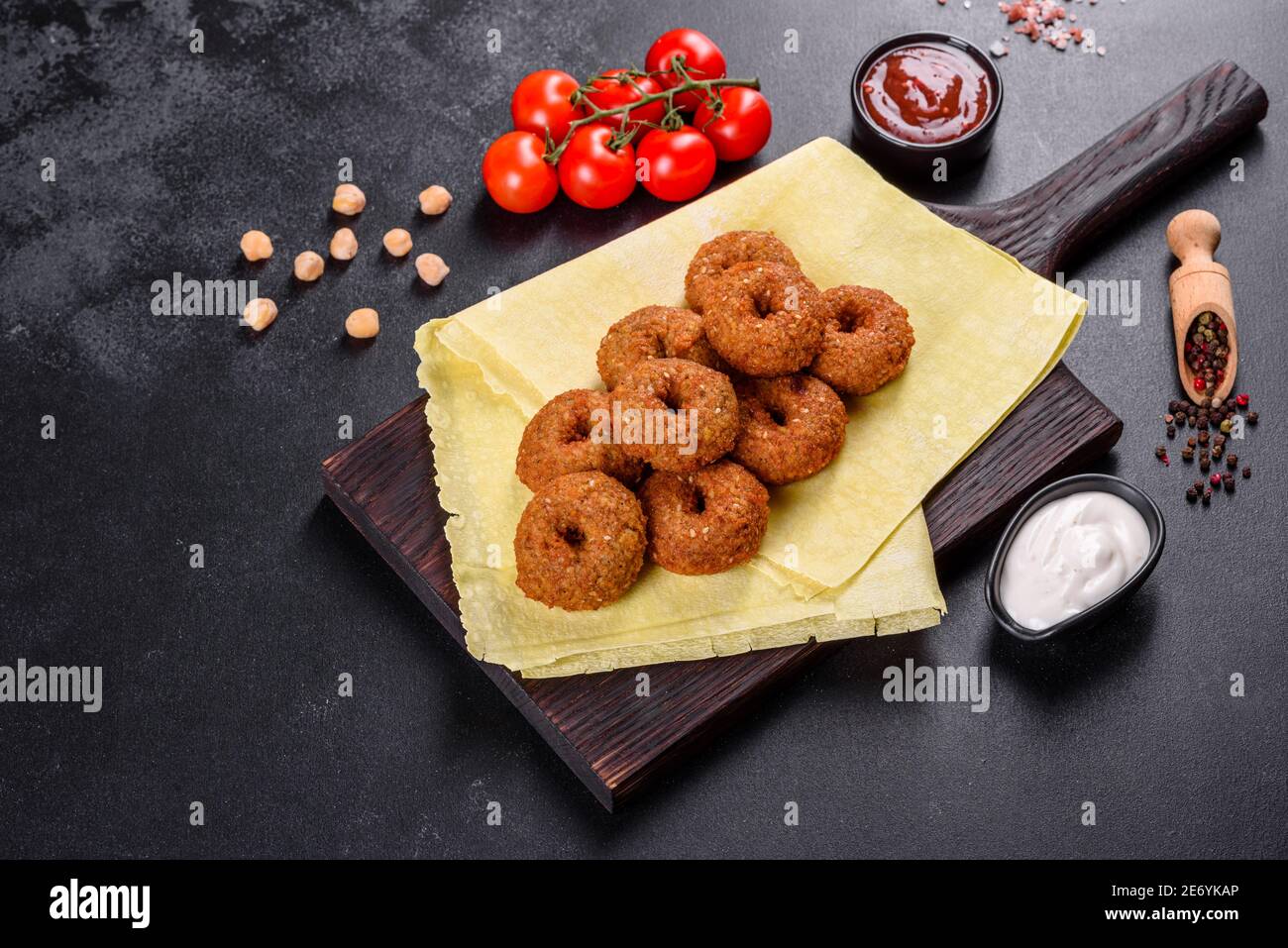 Beautiful delicious fresh chickpea falafel with sauces on a concrete ...