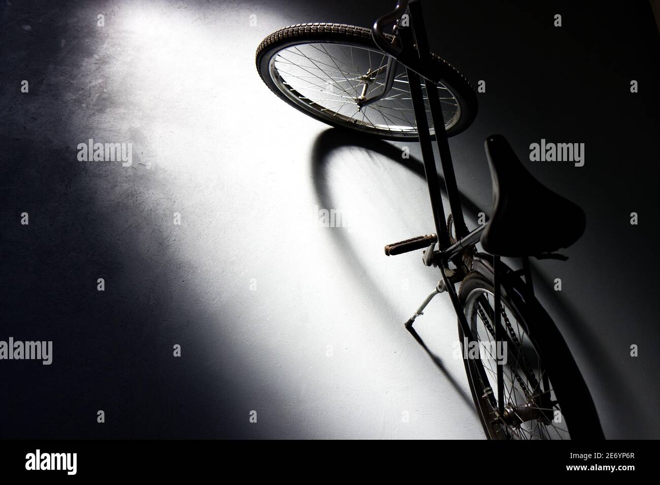 High angle shot of a vintage bicycle parked in a dark garage Stock ...