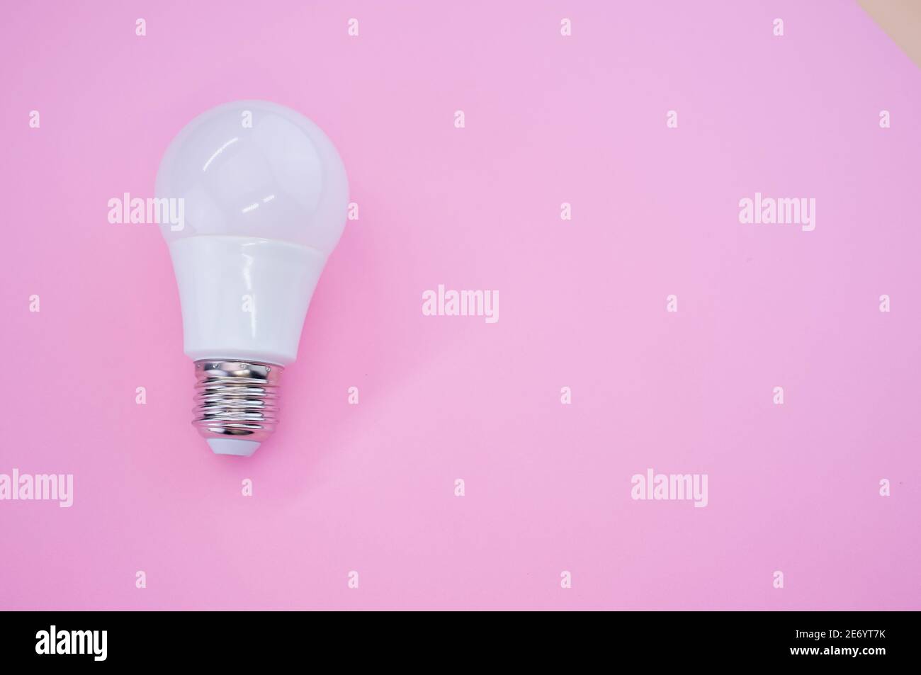 High angle shot of a lightbulb on a pink surface Stock Photo - Alamy