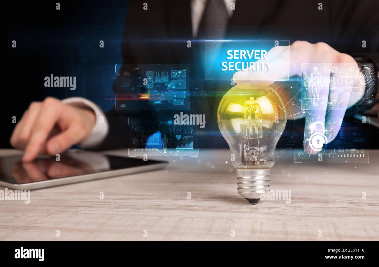Businessman holding lightbulb with SERVER SECURITY inscription, online ...