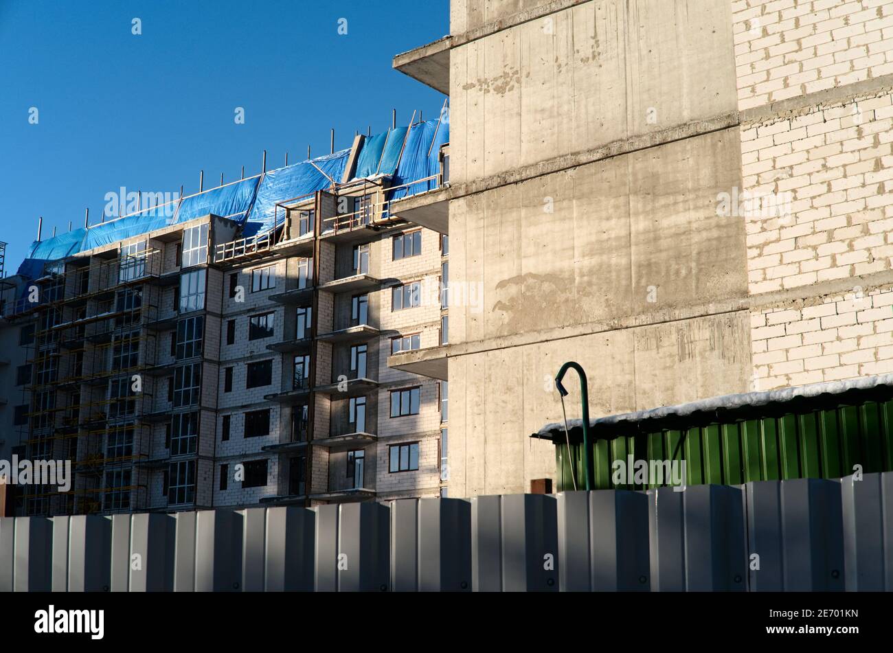 Building under construction in city. Construction site of residential ...