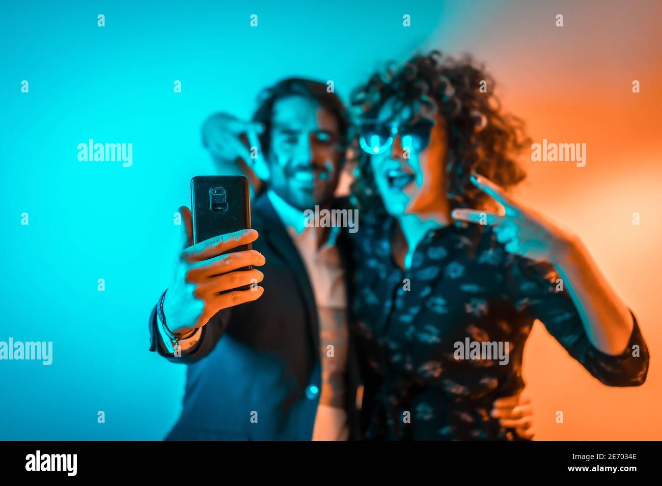 Male And A Female Taking A Selfie At A Club In A Happy Party Mood Stock