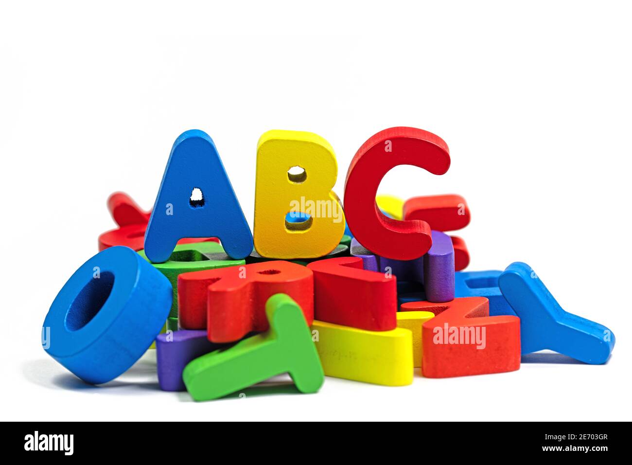 Colorful wooden letters against a white background Stock Photo - Alamy