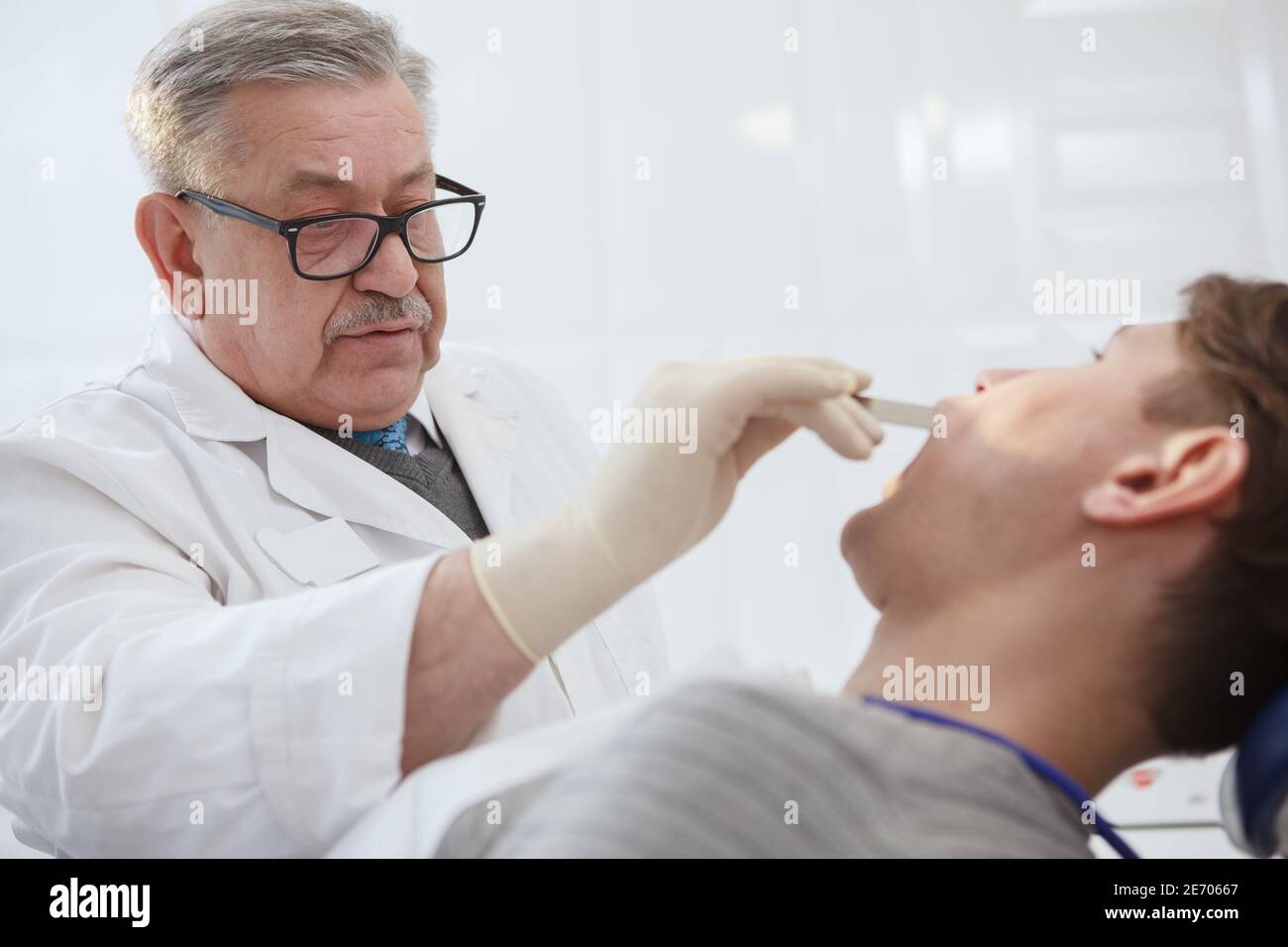 Dentist examining teeth senior hi-res stock photography and images - Alamy