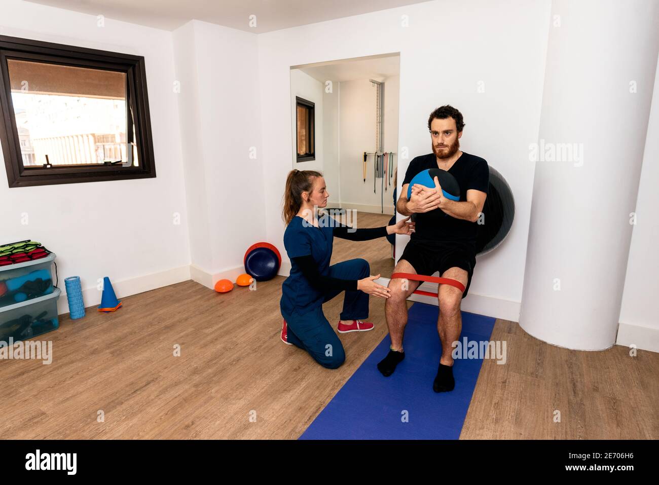 Stock photo of a man receiving help by physiotherapist professional ...