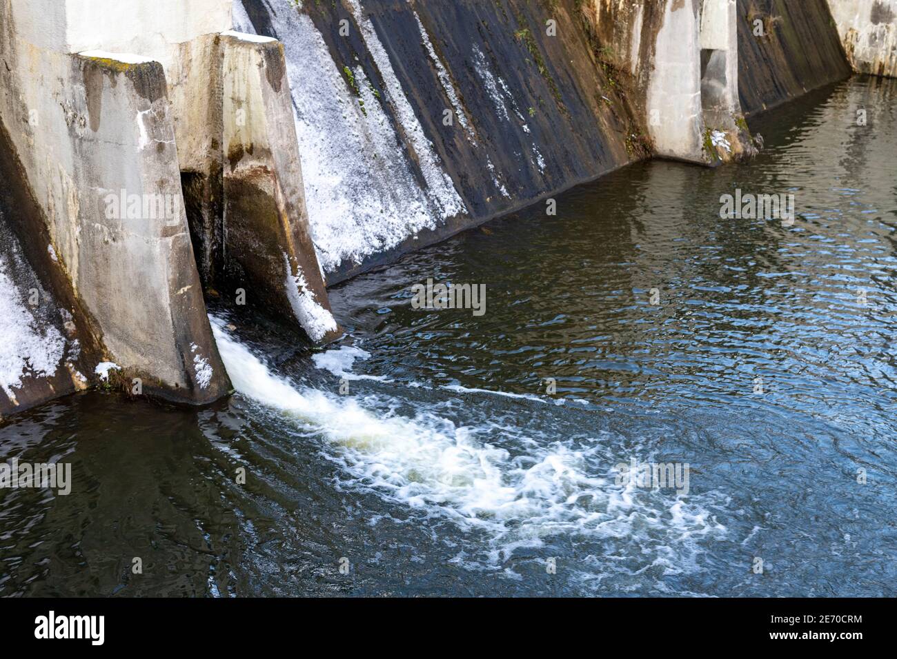Water drain in a small dam. View of the overflow channel in the ...