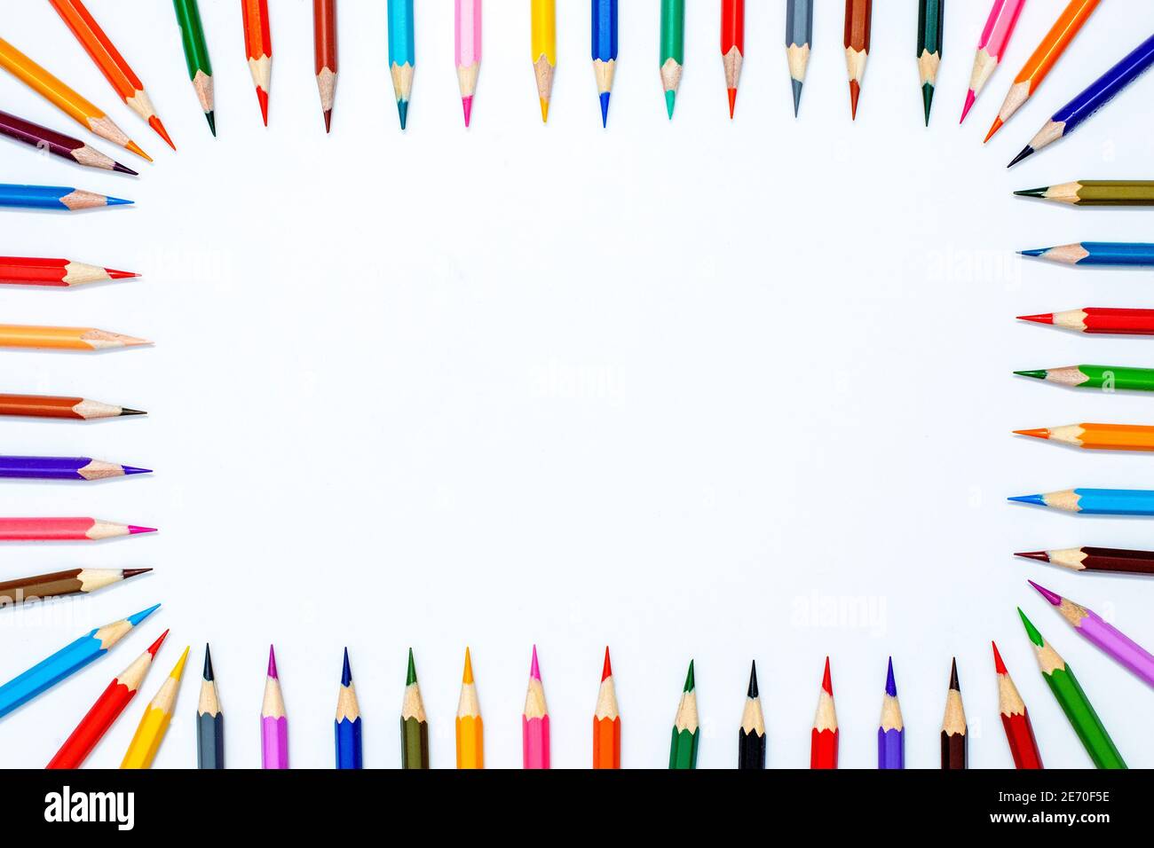frame from color pencils in a row with the top on a white background ...