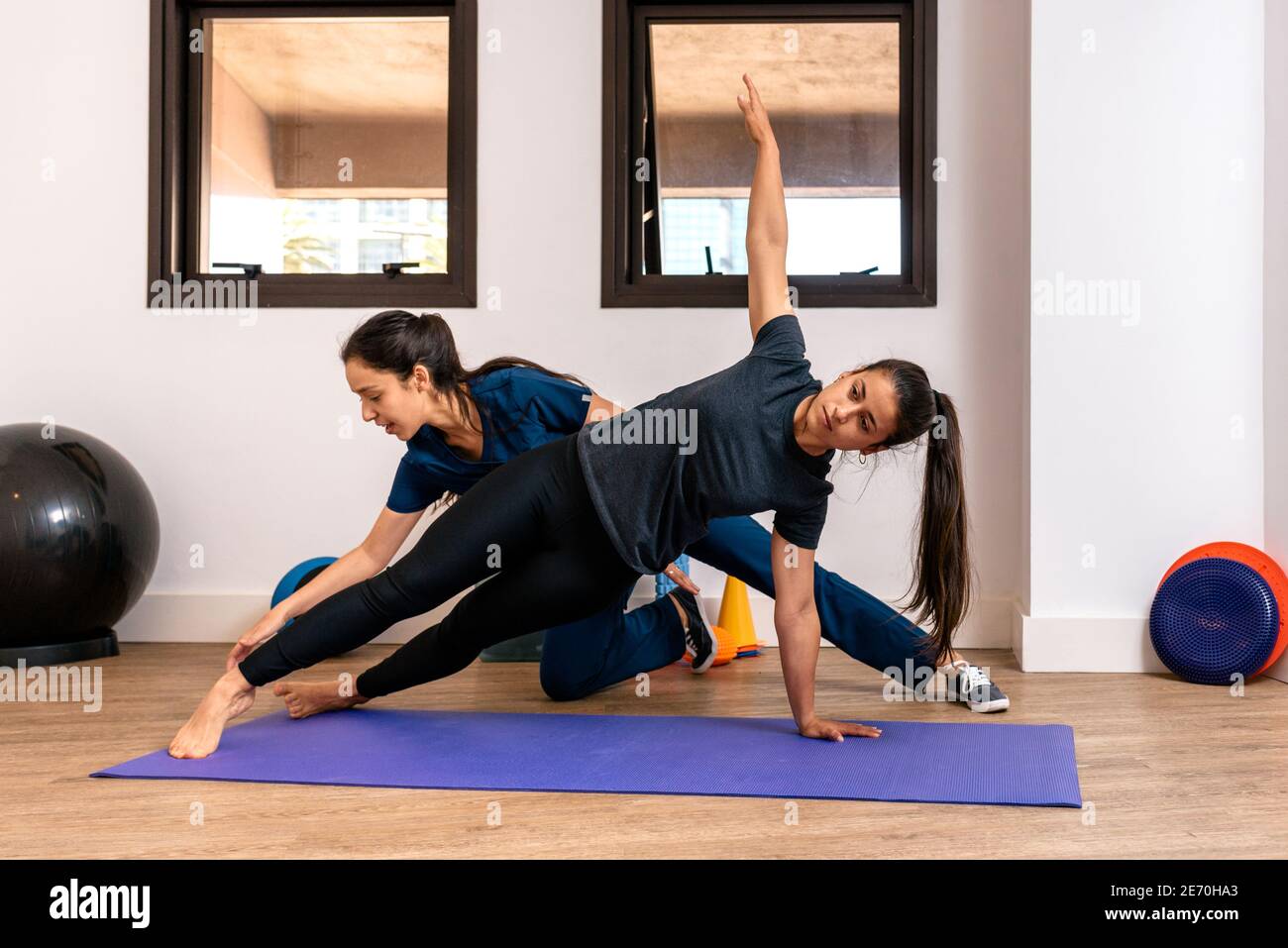 Stock photo of a woman receiving help by physiotherapist professional ...