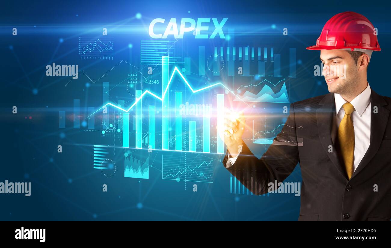 Handsome businessman with helmet drawing CAPEX inscription ...