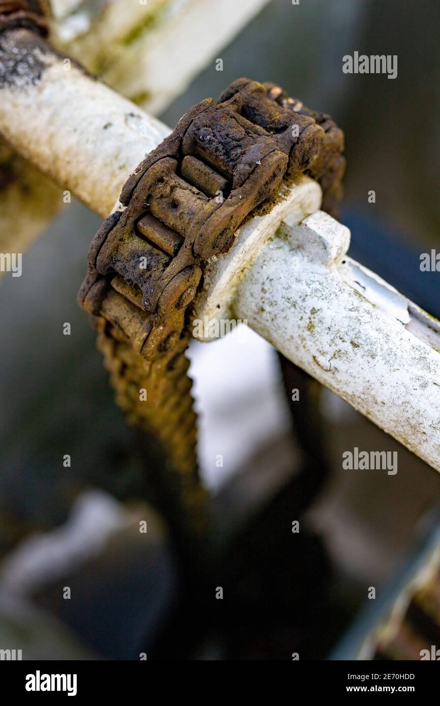 Small chain gear. Steel structure in the dam. Light background Stock ...
