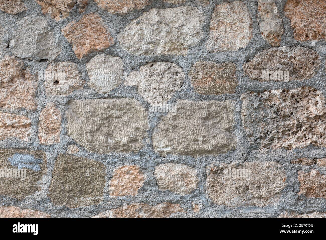 Stone wall made of huge large bricks with concrete and cement. Sturdy ...