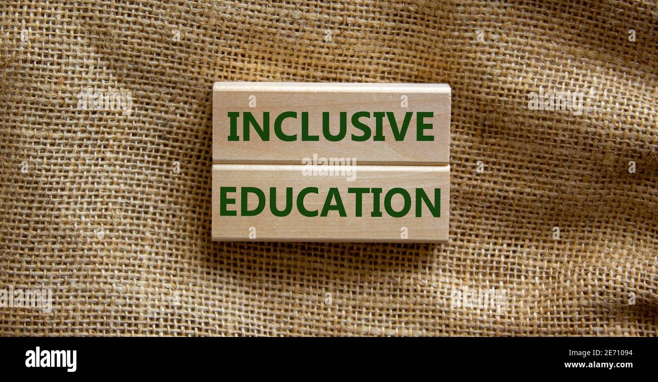 Inclusive education symbol. Wooden blocks form the words 'inclusive ...