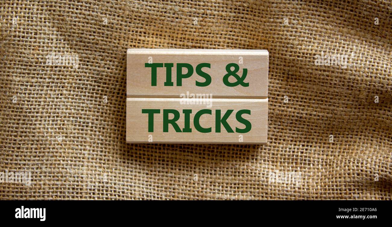 Tips and tricks symbol. Wooden blocks with words 'Tips and tricks ...