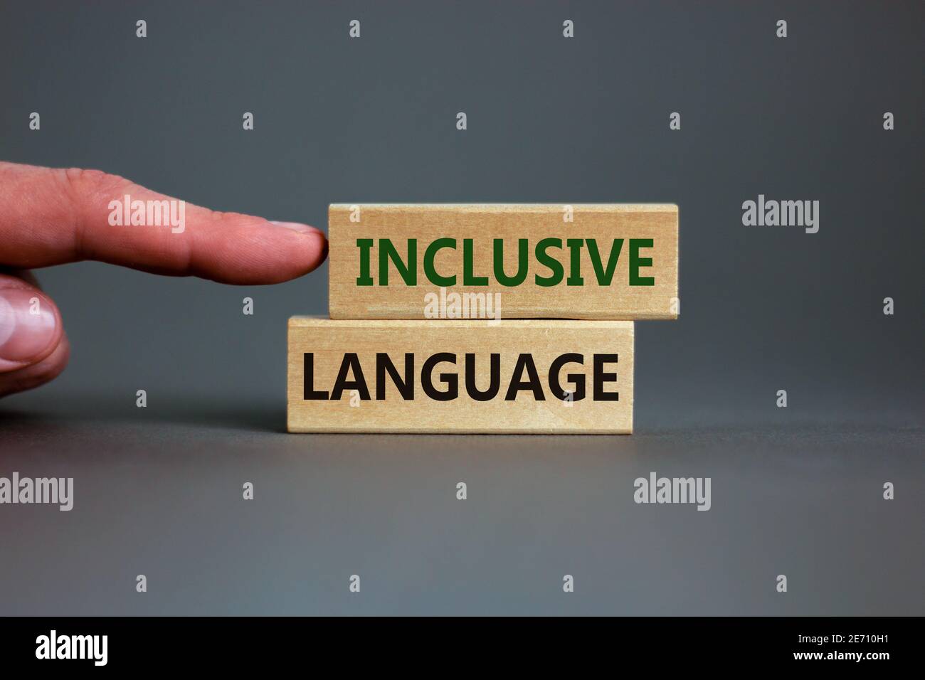 Inclusive language symbol. Wooden blocks form the words 'inclusive ...