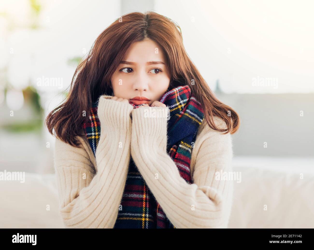 Woman cold house worried hi-res stock photography and images - Alamy