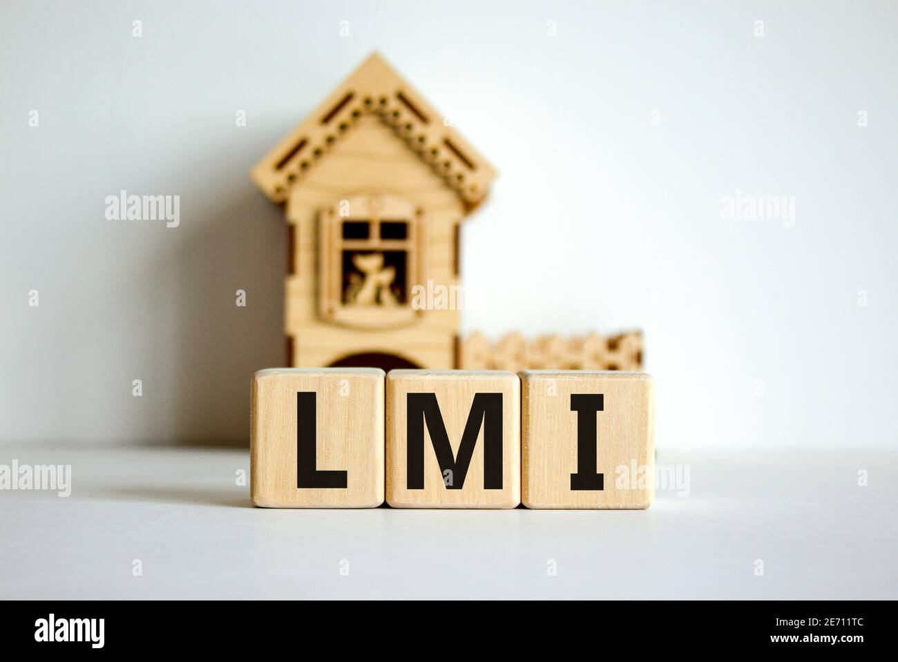 LMI, lenders mortgage insurance symbol. Wooden cubes, the word 'LMI ...