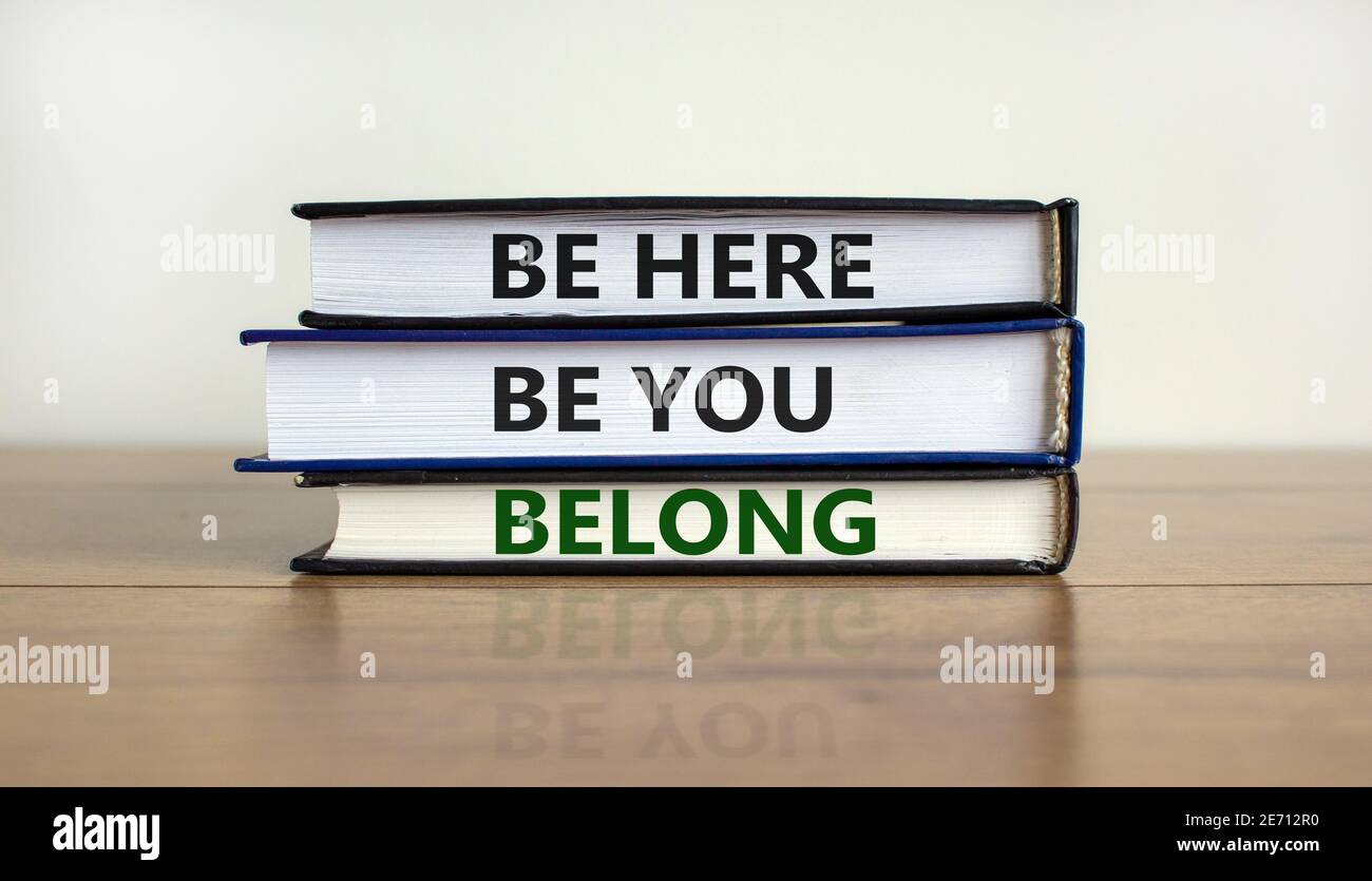 Belong symbol. Books with words 'be here, be you, belong' on beautiful ...