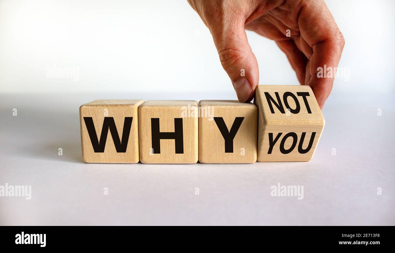 Why not you symbol. Businessman turns a cube and changes words why you ...