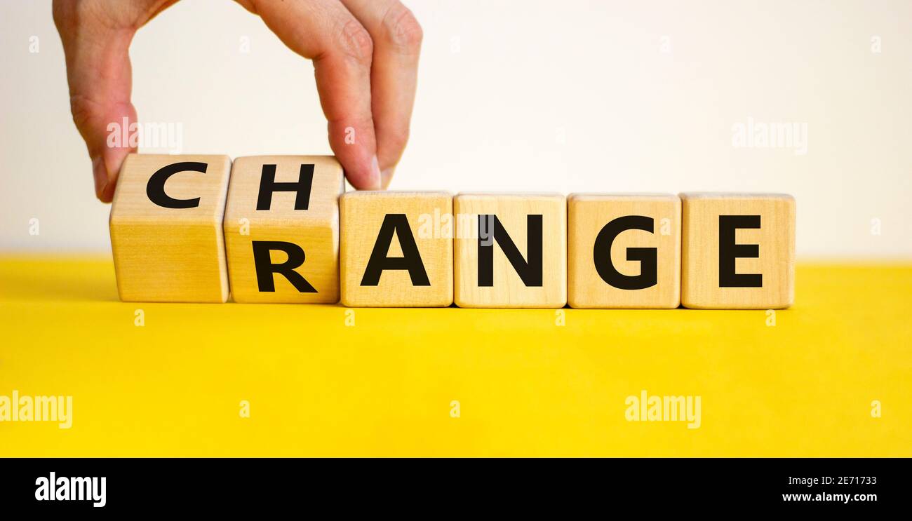 Change range symbol. Businessman turns cubes and changes the word ...
