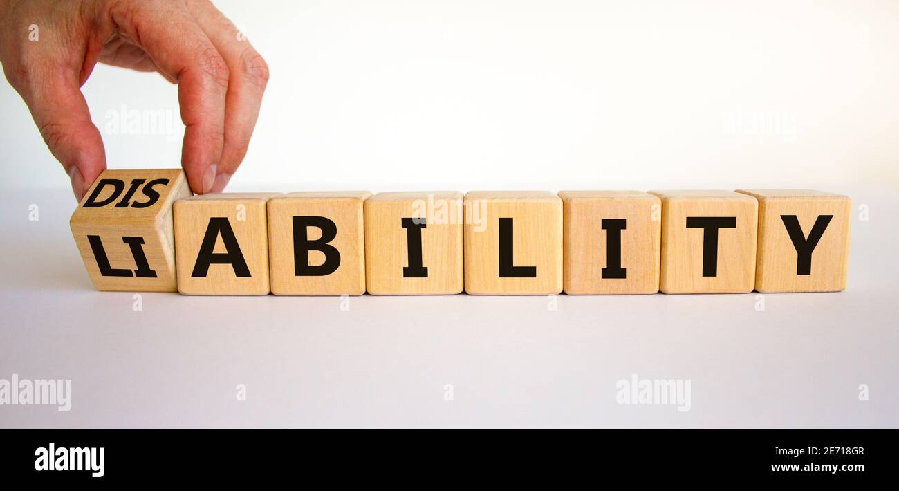 Liability or disability symbol. Businessman turns cubes and changes the ...