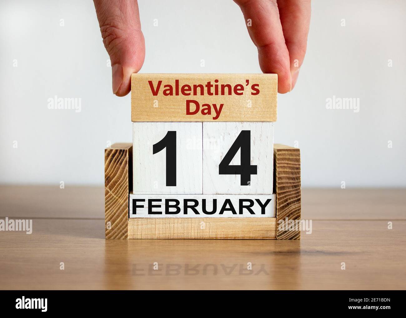 February 14 valentines day symbol. Wooden block with words 'Valentines ...