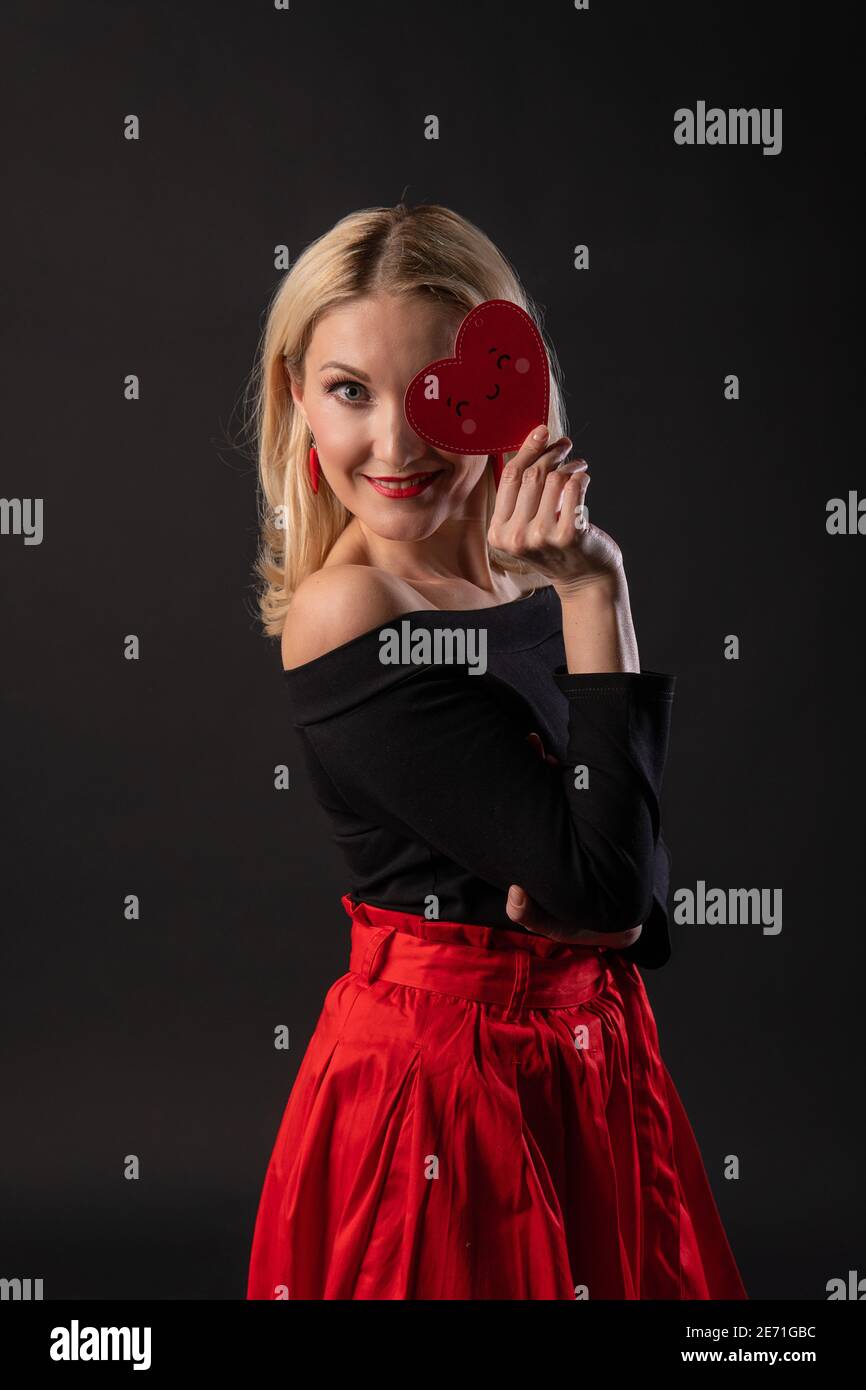 Girl holding a heart at eye level valentine valentine background ...