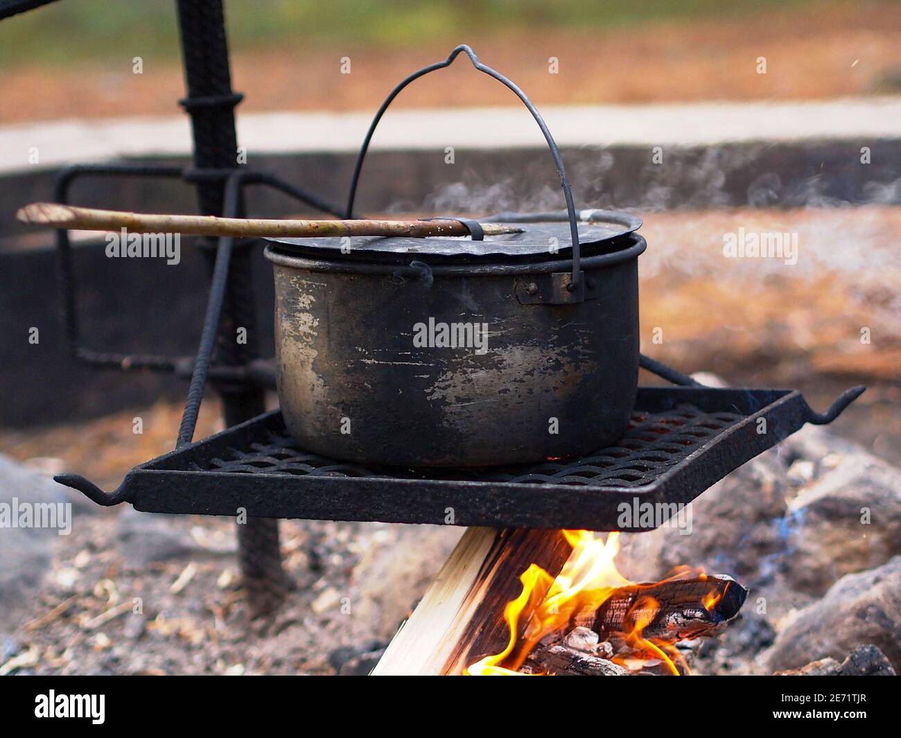 Dutch oven over a campfire, cooking at the campsite Stock Photo - Alamy