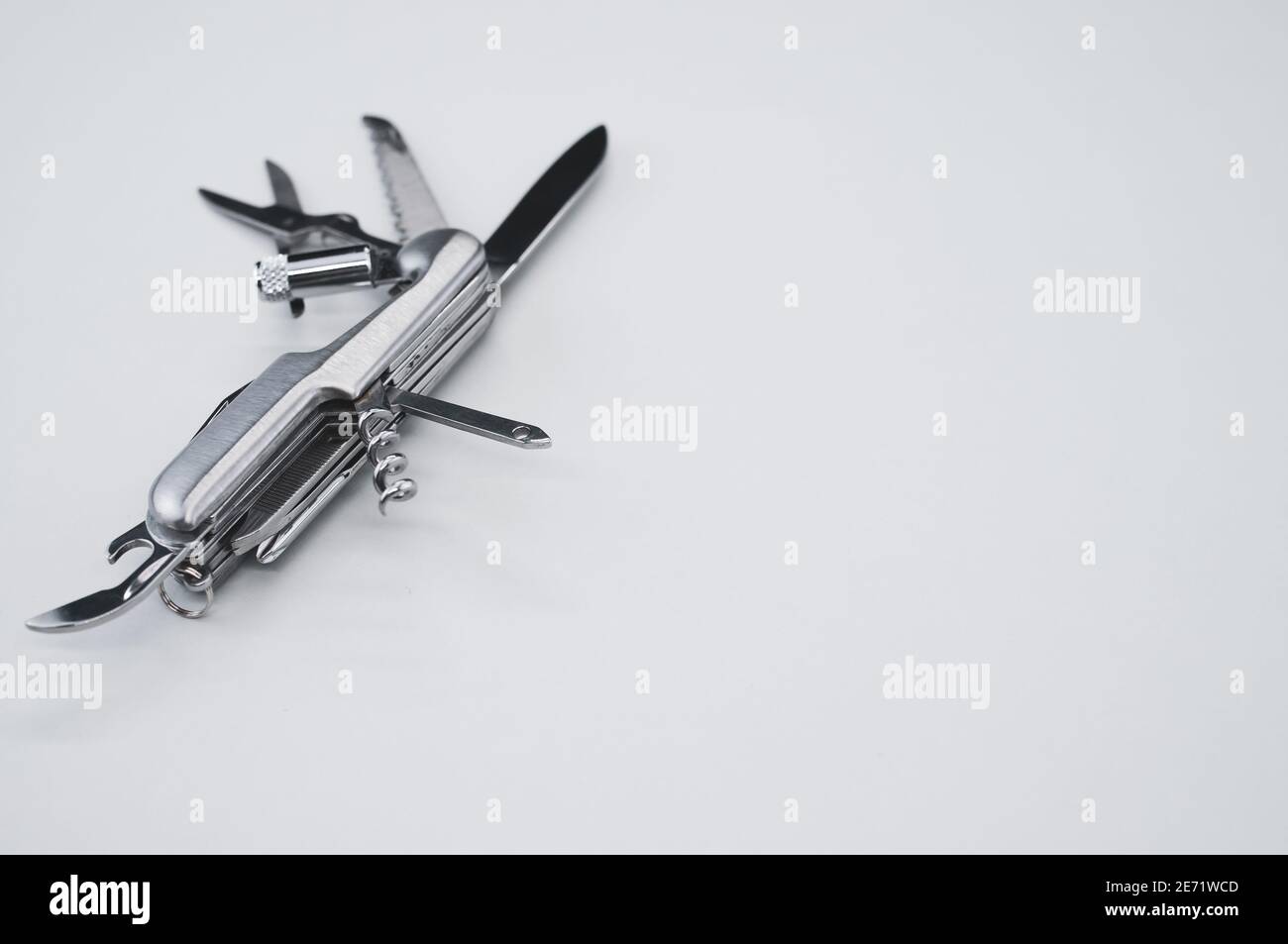High angle shot of a swiss army knife on a grey surface Stock Photo - Alamy