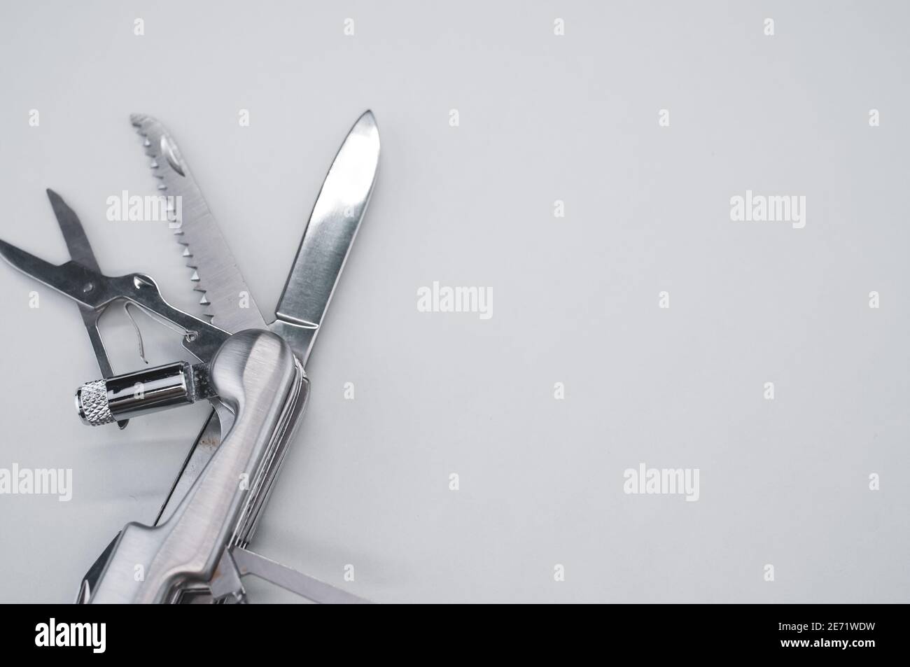 High angle shot of a swiss army knife on a grey surface Stock Photo - Alamy