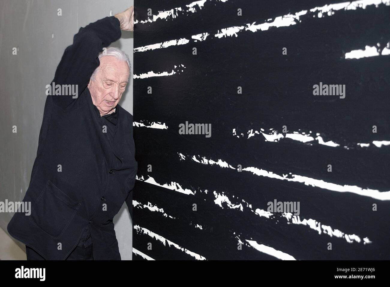 Famous painter Pierre Soulages poses in front of some of his canvas in ...