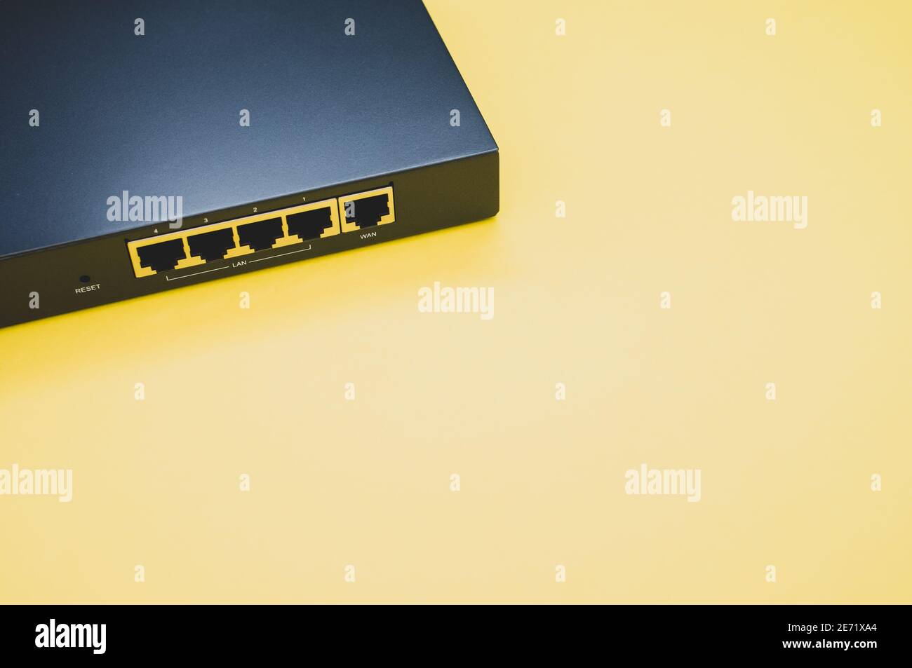 High angle shot of the USB ports on an electronic on a yellow surface ...