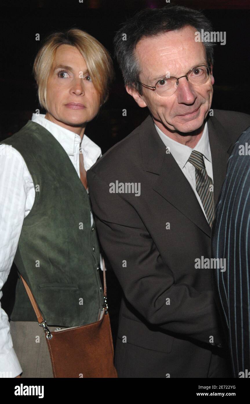 Director Patrice Leconte poses for pictures with his wife as they ...