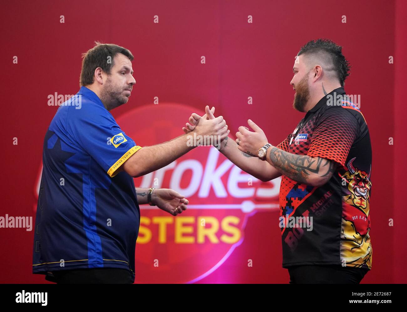 Adrian Lewis congratulates Michael Smith (right) after their set during ...