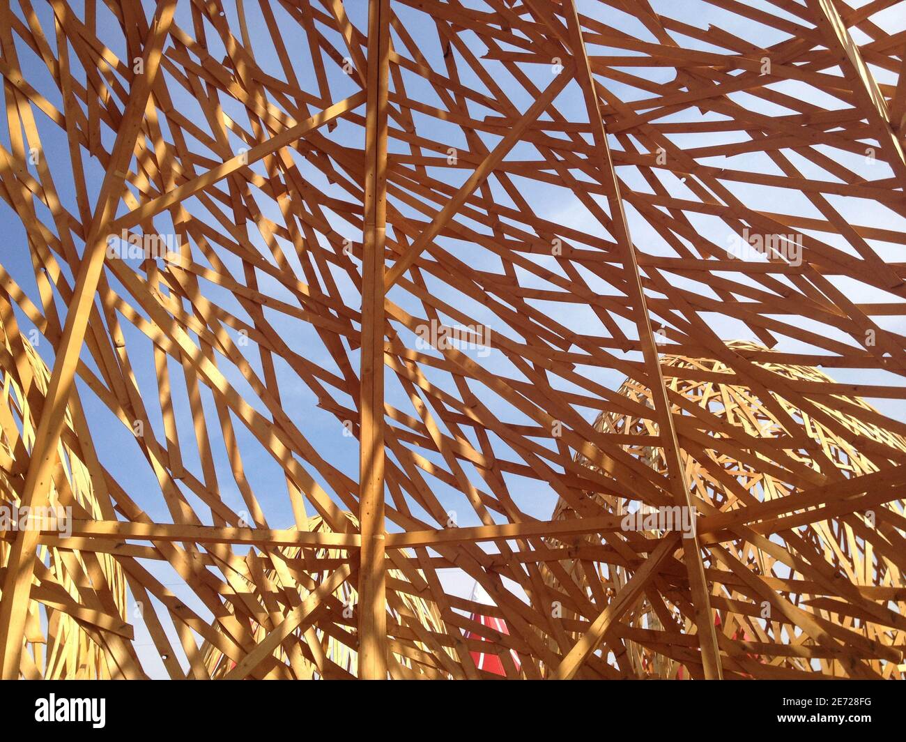 curved light thin wooden structure with blue sky Stock Photo - Alamy