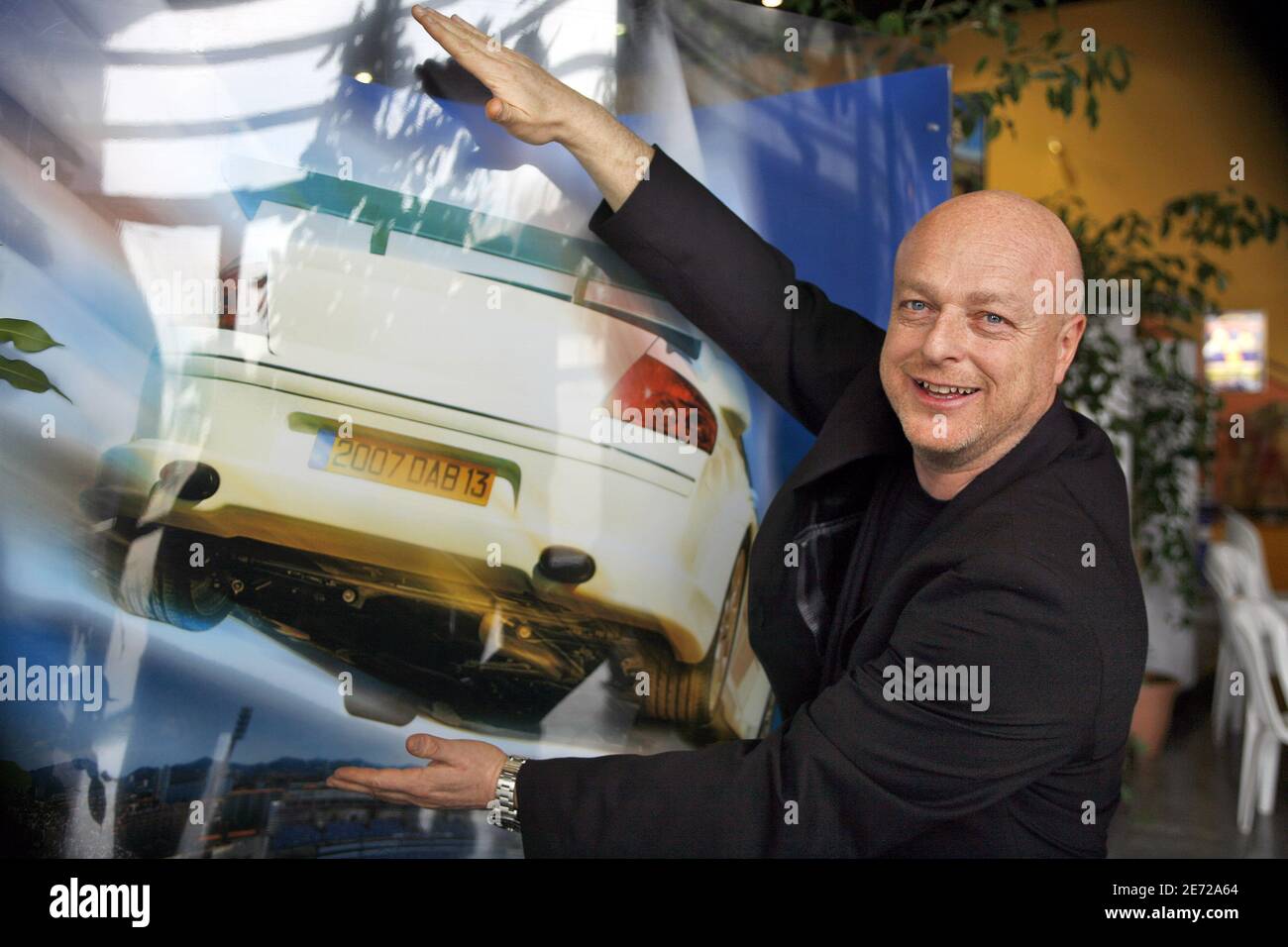 Gerard Krawczyk, poses before the projection of his new opus 'Taxi 4' in Plan de Campagne, near ...