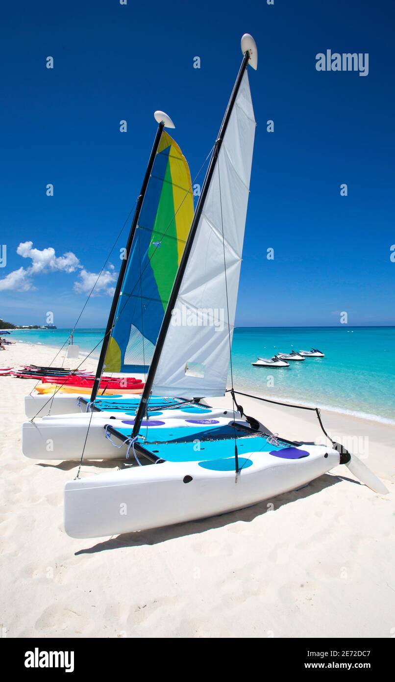Seven Mile Beach, Catamaran Sailboat on water's edge, Grand Cayman ...