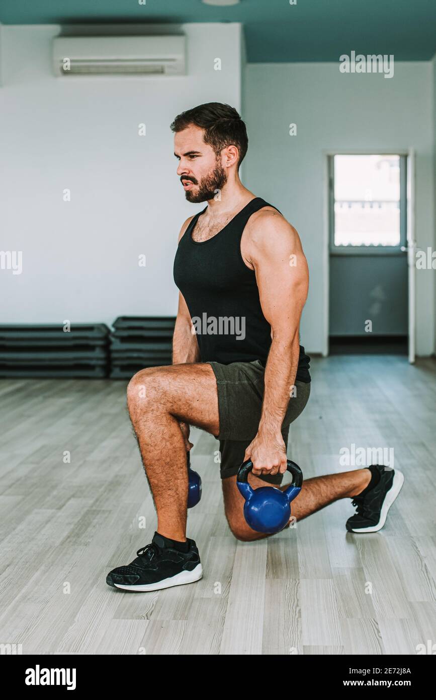 man working out in gym ,fitness training Stock Photo - Alamy