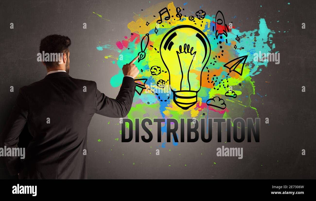 businessman drawing colorful light bulb with DISTRIBUTION inscription ...