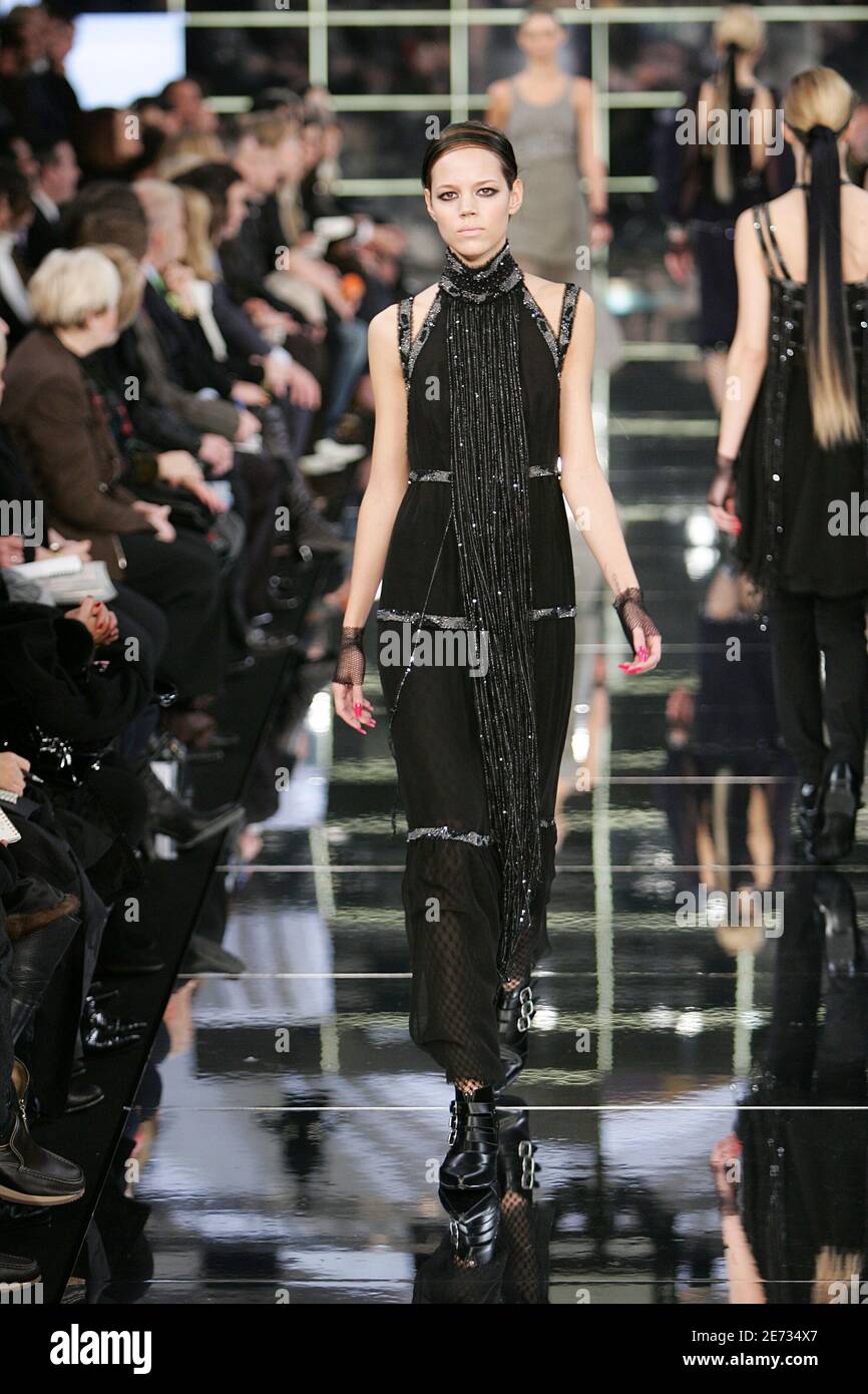 A model on the catwalk wears a creation by Karl Lagerfeld for his Fall ...