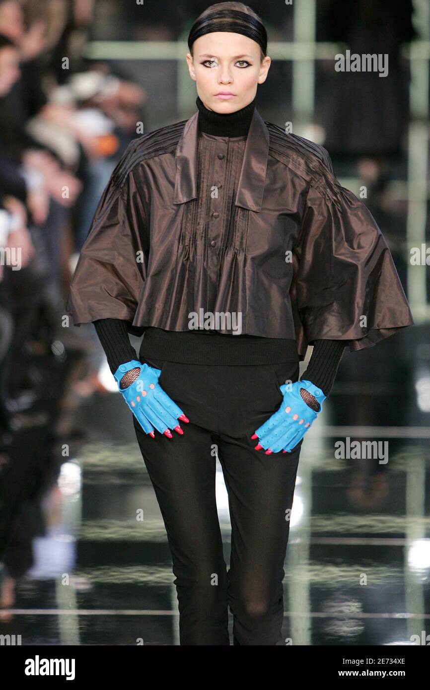 A model on the catwalk wears a creation by Karl Lagerfeld for his Fall ...