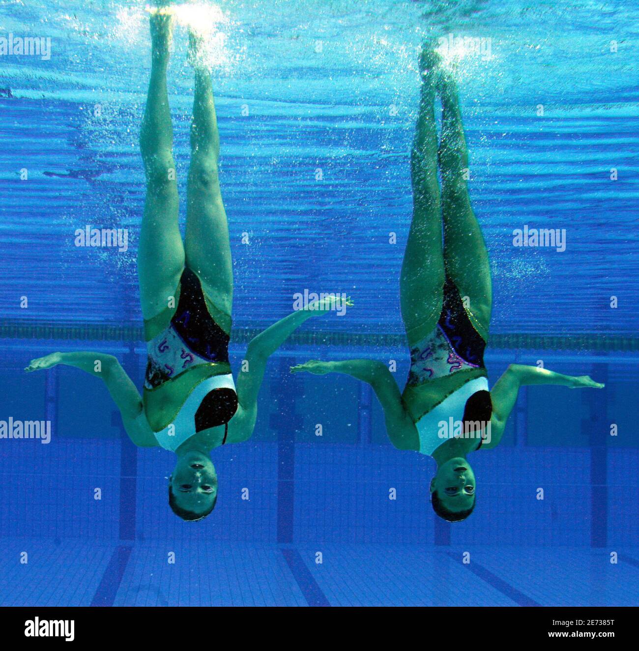 Synchronized swimmers underwater hi-res stock photography and images ...