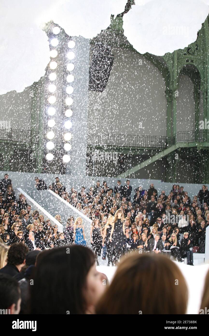 Models hit the catwalk under fake snow during the Chanel Fall-Winter ...