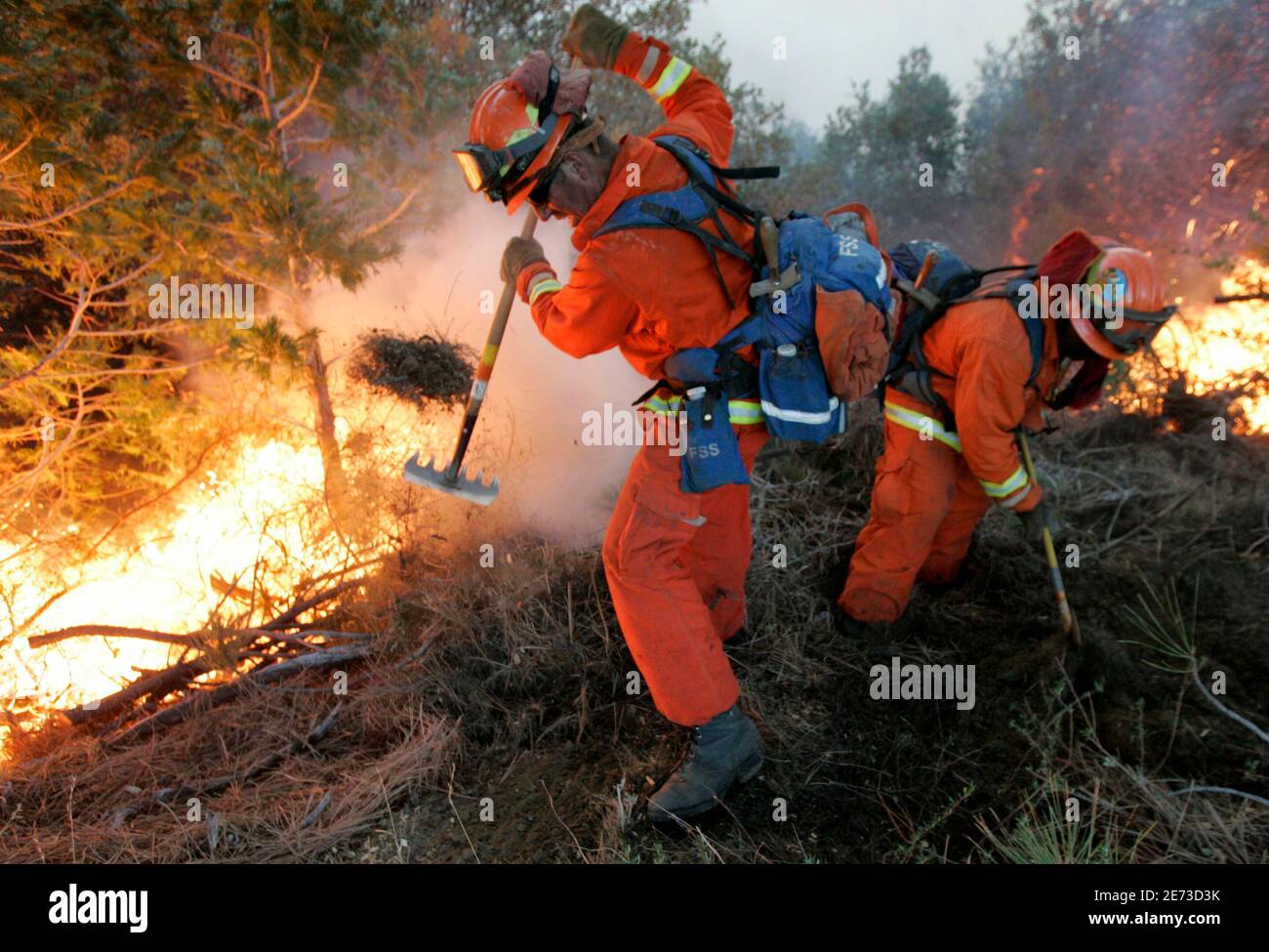 Firefighters dig a fire line hi-res stock photography and images - Alamy