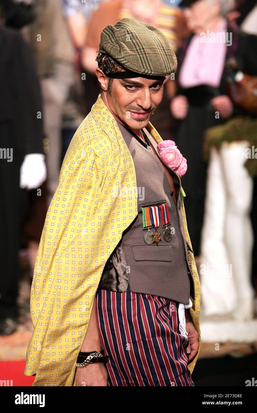 British designer John Galliano appears on the catwalk at the end of his ...