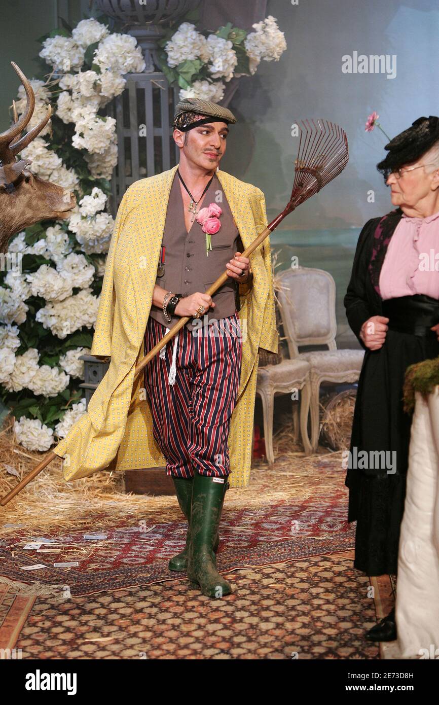 British designer John Galliano appears on the catwalk at the end of his ...