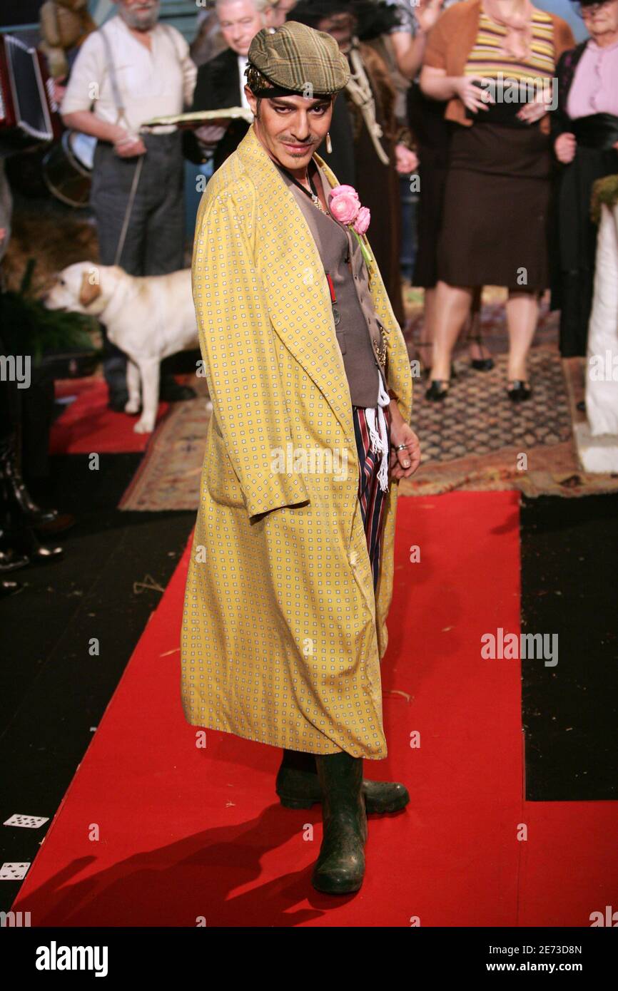 British designer John Galliano appears on the catwalk at the end of his ...
