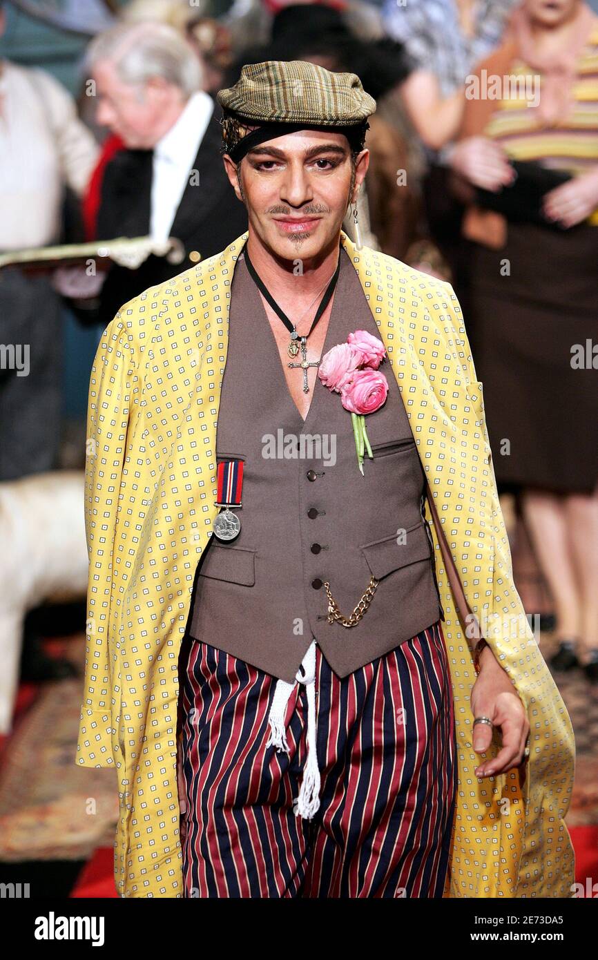 British designer John Galliano appears on the catwalk at the end of his ...