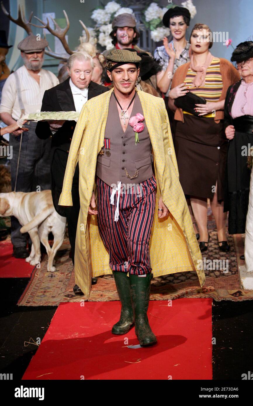 British designer John Galliano appears on the catwalk at the end of his ...