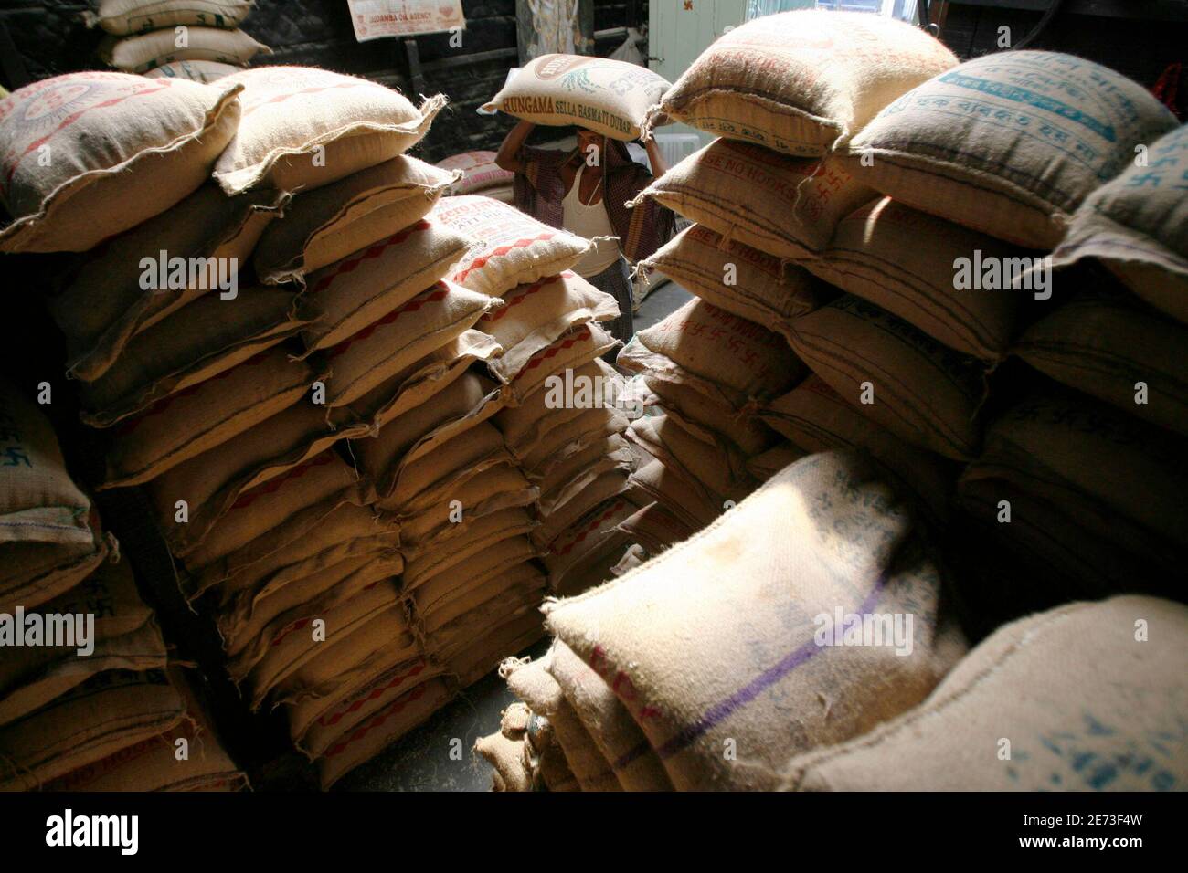 Man carrying a rice bag High Resolution Stock Photography and Images ...