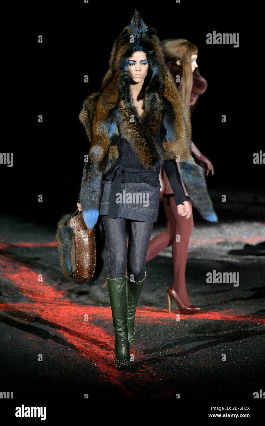 Two models display creations by British fashion designer Alexander ...